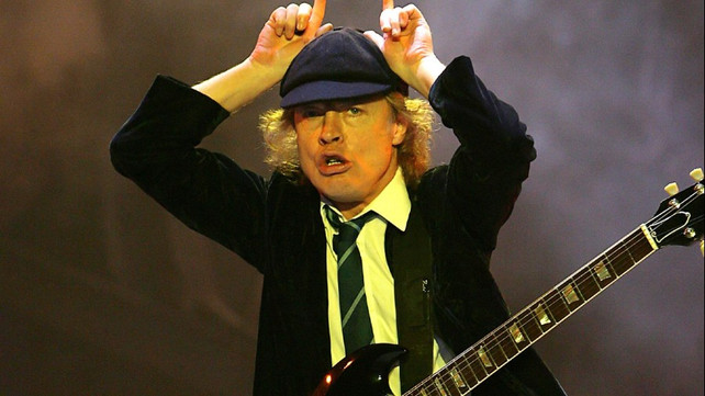 Angus Young Explains Where AC/DC Band Name Came From, Talks How He Ended Up Wearing Schoolboy ...